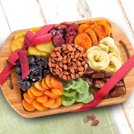 Dried Fruit Assortment with Almonds on Bamboo Cutting Board Serving ...